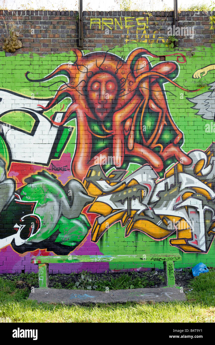 graffiti on the wall below a railway line art wallart community project ...