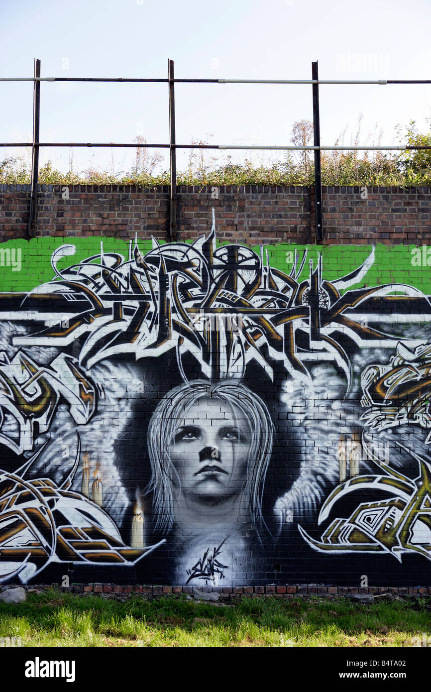 graffiti on the wall below a railway line art wallart community project ...
