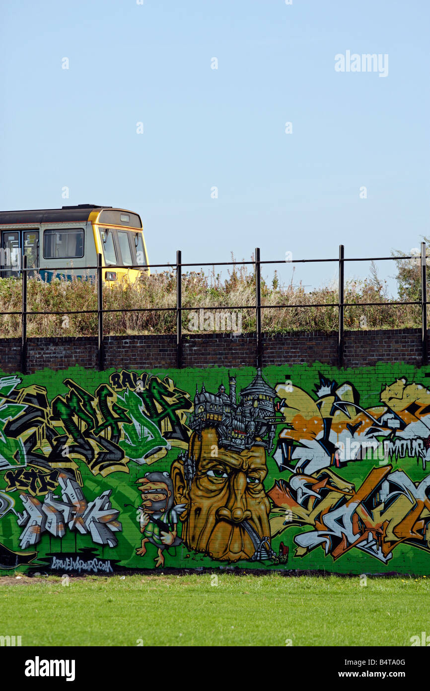 graffiti on the wall below a railway line art wallart community project ...