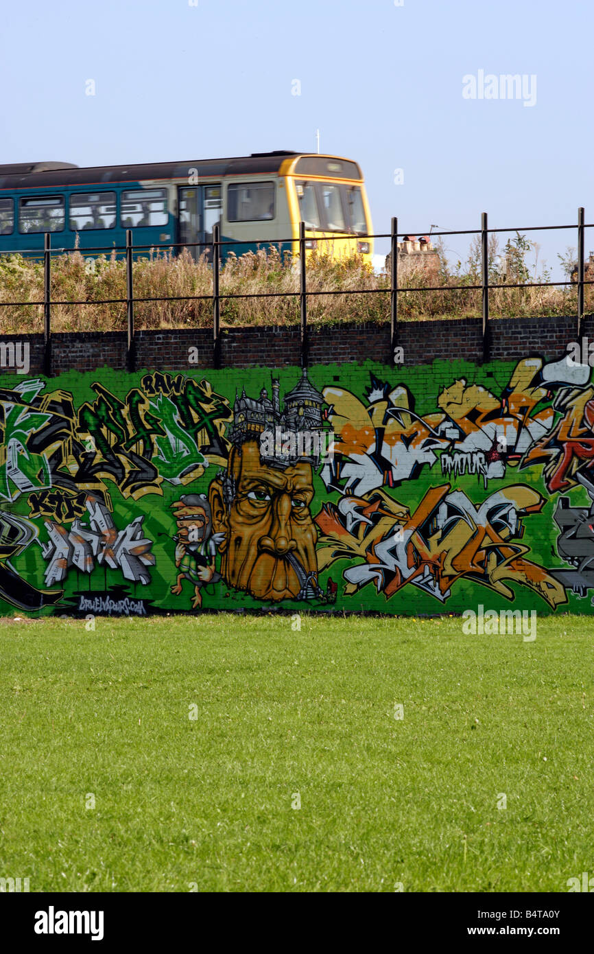 graffiti on the wall below a railway line art wallart community project ...