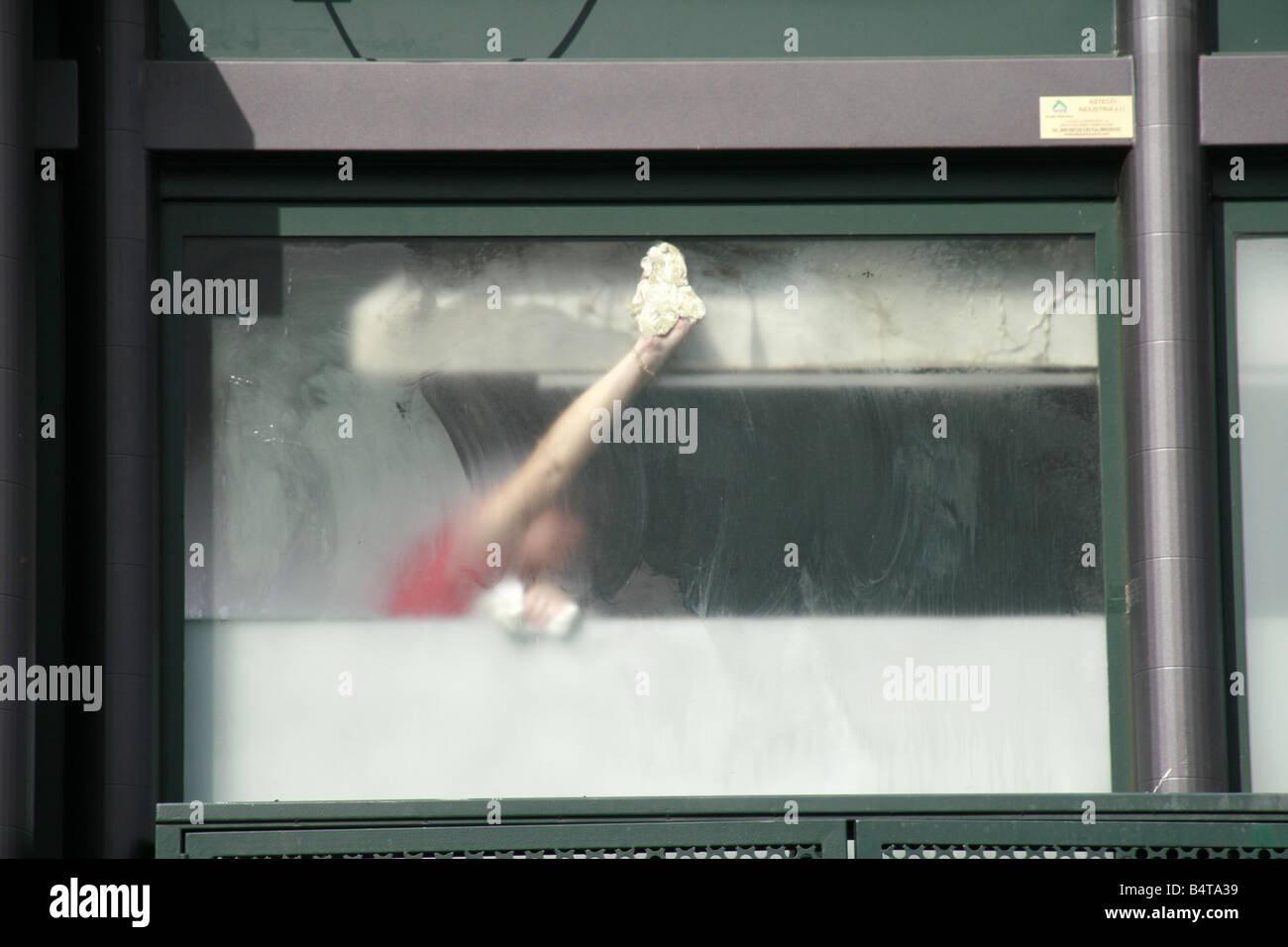 detail of person cleaning dirty shop window Stock Photo - Alamy