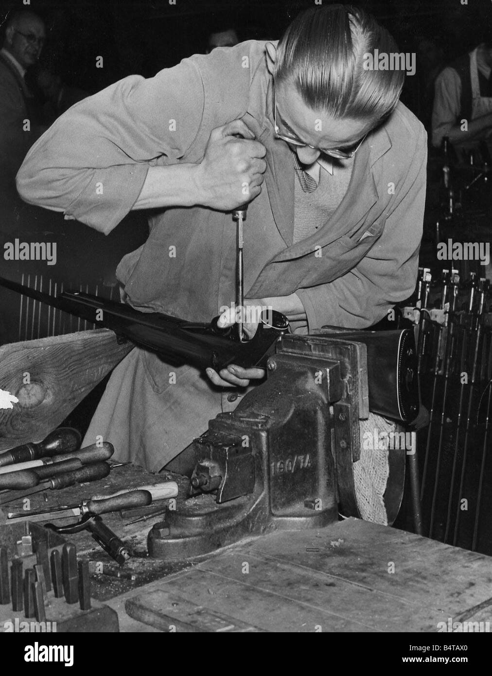 Mechanical Engineer works on a rifle in gun factory, Gun Quarter area ...