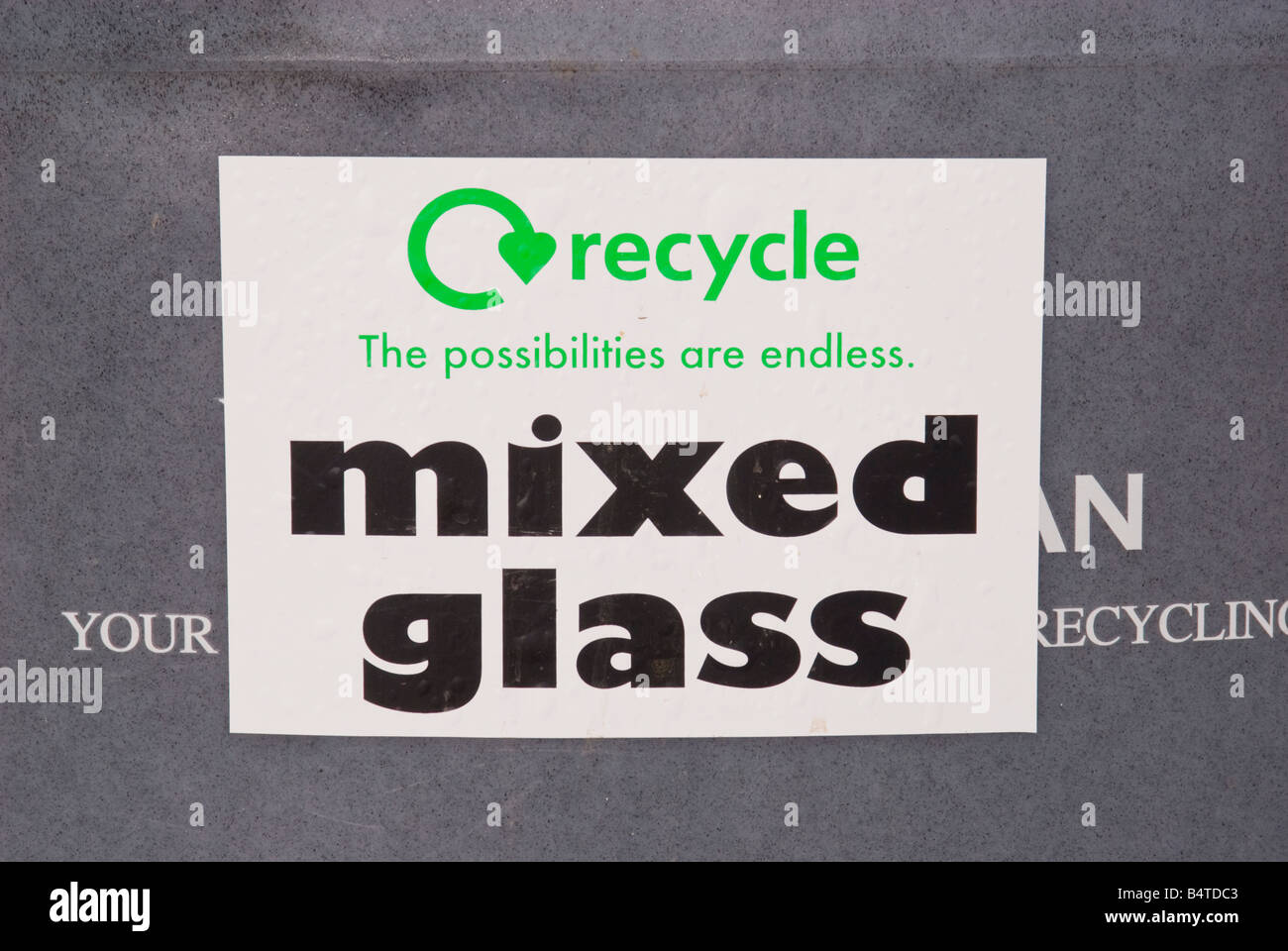 A sign on a recycling bin asking for mixed glass Stock Photo - Alamy