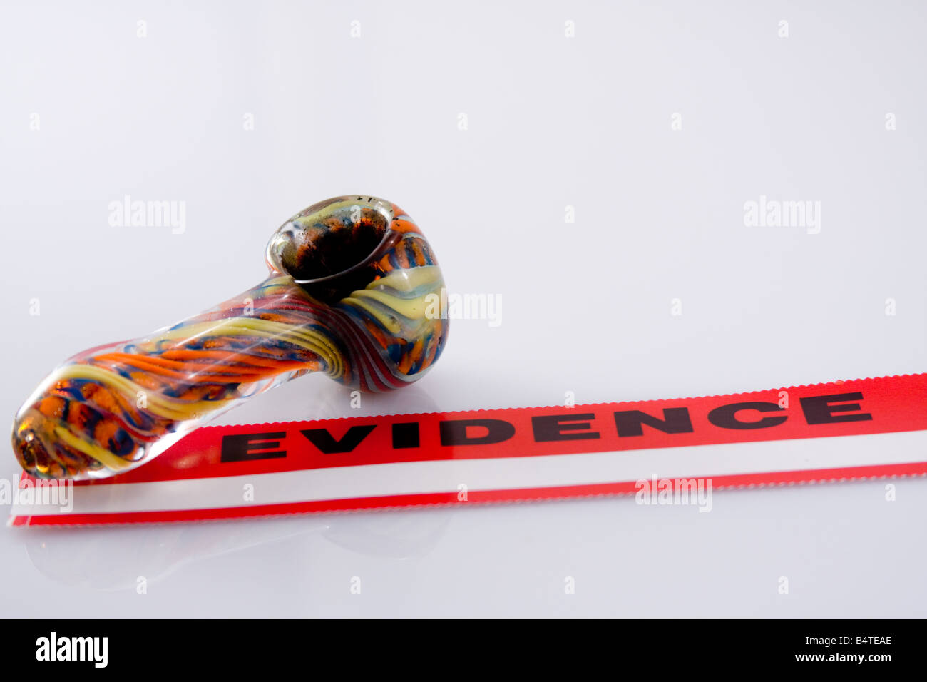 Marijuana pipe with Evidence sticker Stock Photo - Alamy