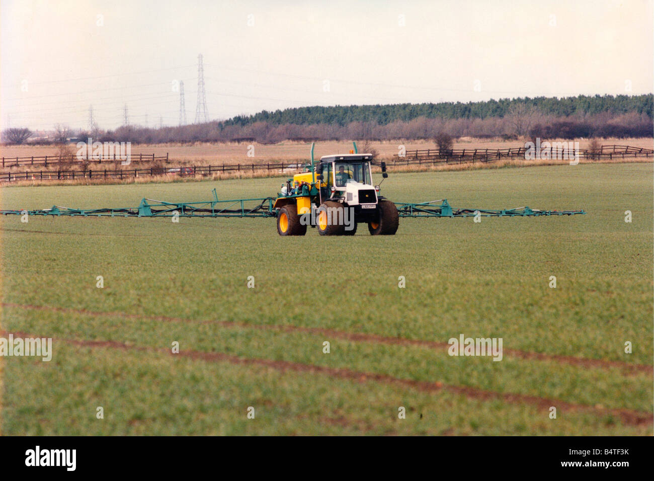 A farmer spraying his field with insecticide Stock Photo - Alamy