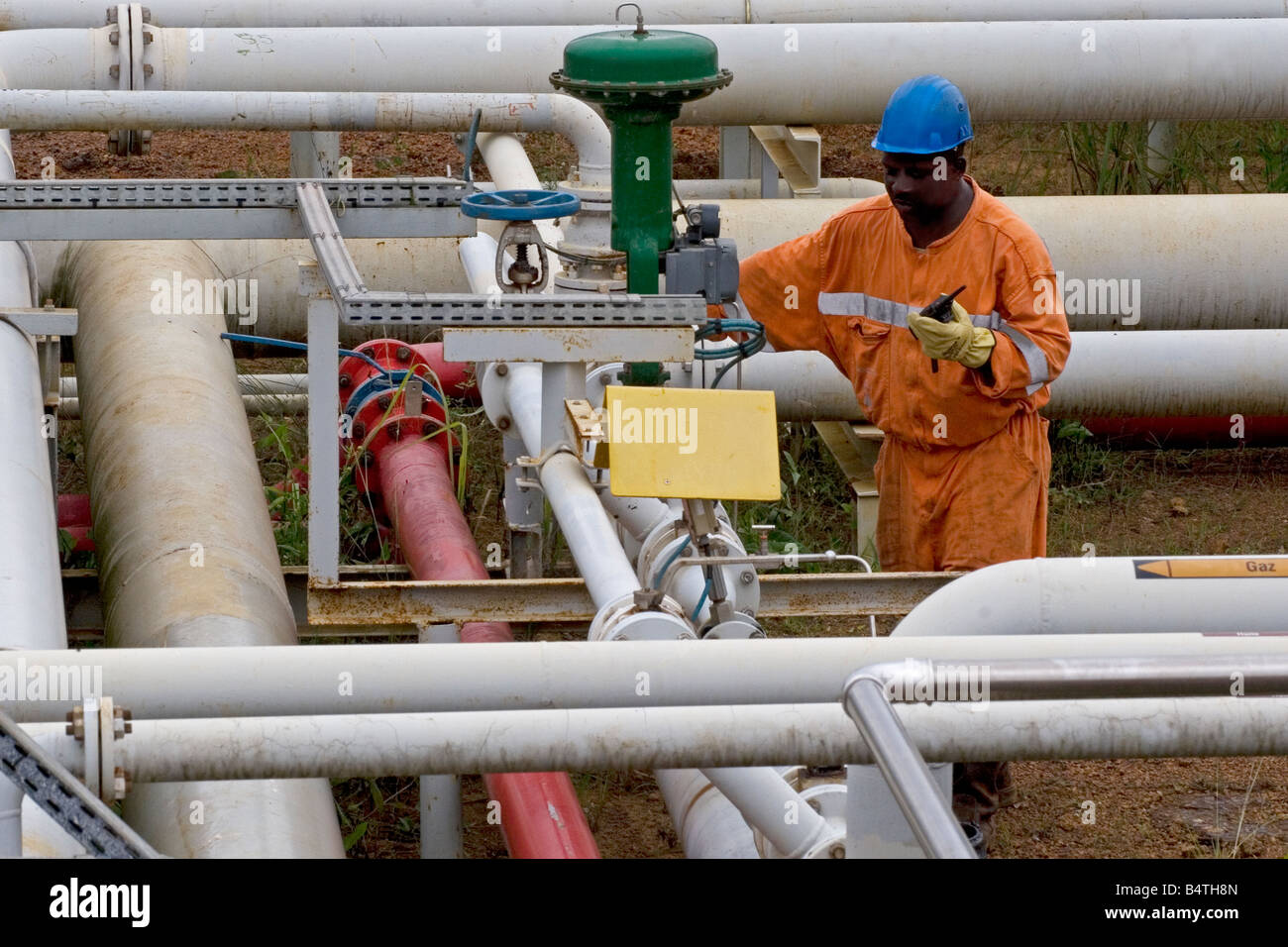 Onshore oil processing plant showing pipework with oil production ...