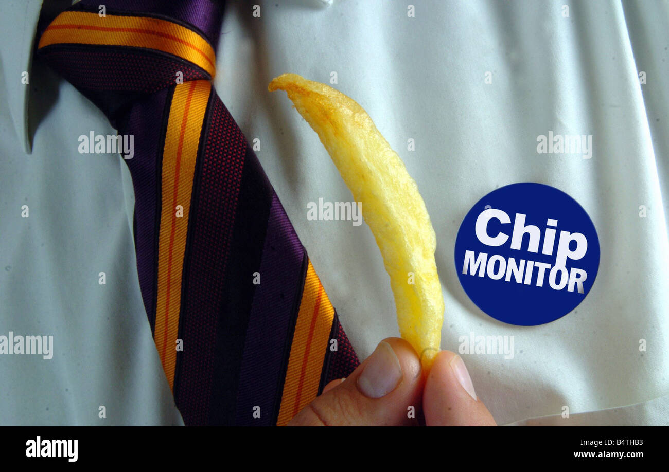 A school pupil pictured with a chip with a badge saying Chip Monitor ...