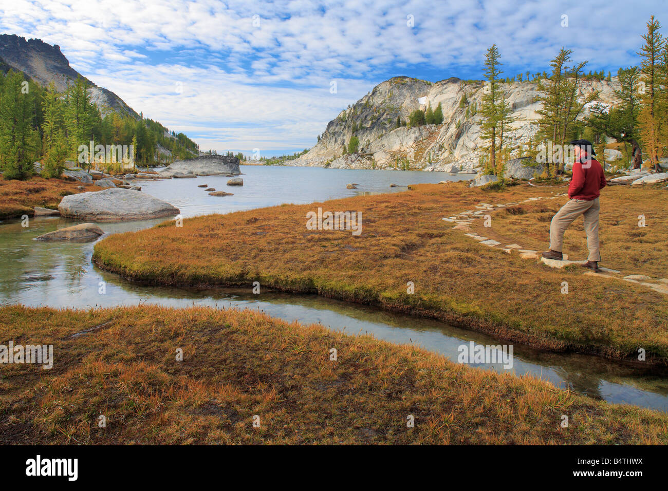 Hiker walking near creek at Perfection Lake in the Enchantment Lakes ...