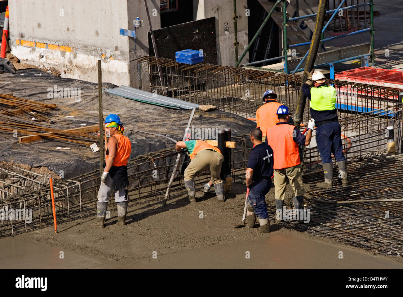 Construction / Construction Workers pour Cement on a Building Site ...