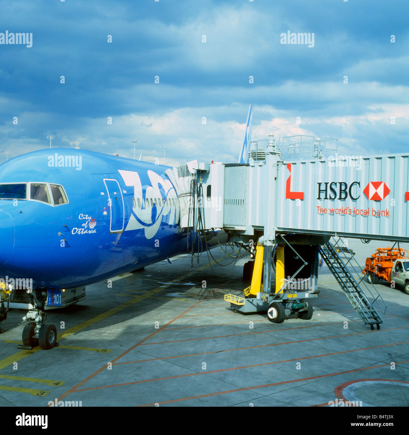 Zoom Airlines plane airplane on the tarmac & HSBC bank walkway loading ...