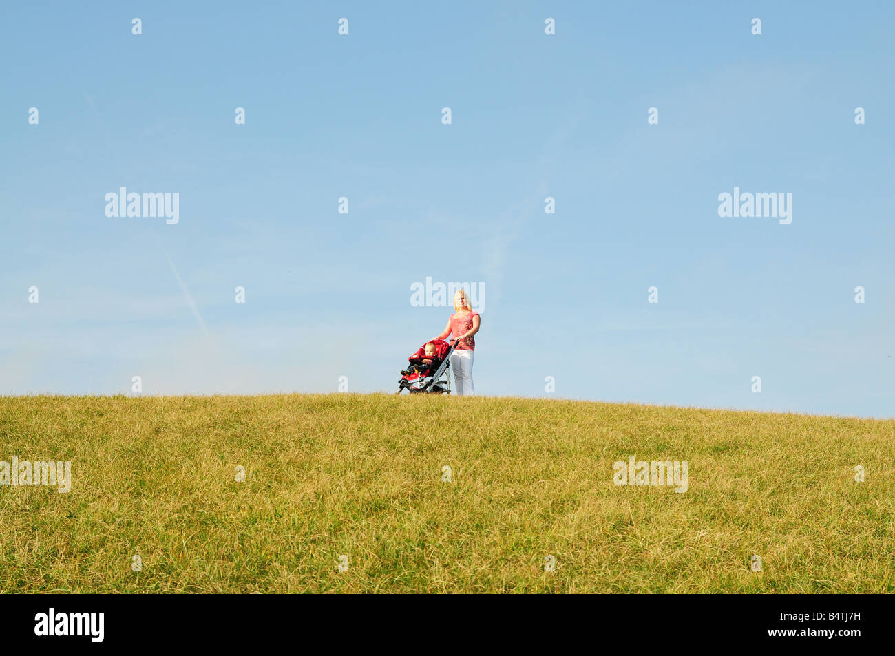 Boy pushing pushchair hi-res stock photography and images - Alamy