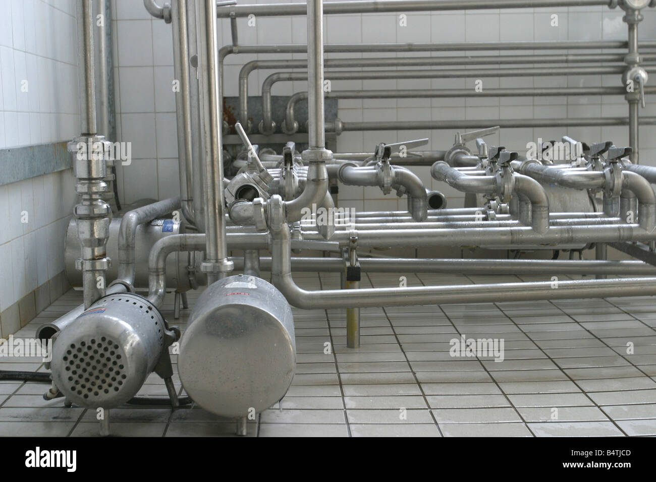 stainless steel pipes and valves in modern dairy Stock Photo - Alamy