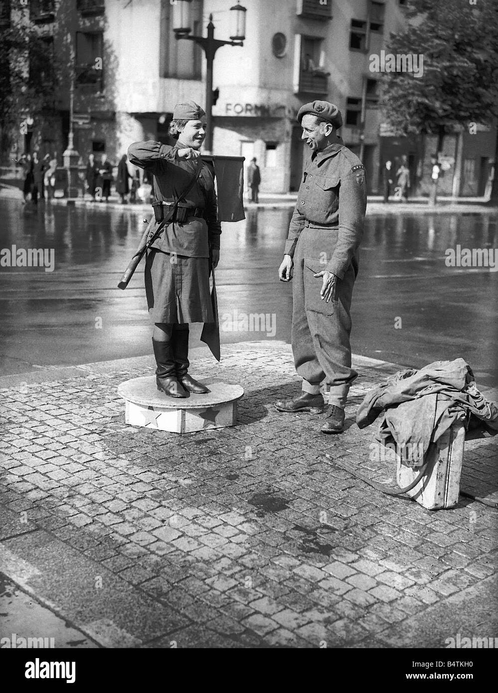 A spot of fraternising between a Russian army girl on traffic duty and ...