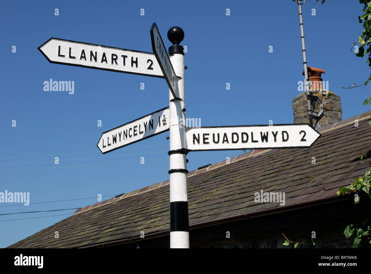 traditional sign post showing Welsh place names in pretty mid Wales ...