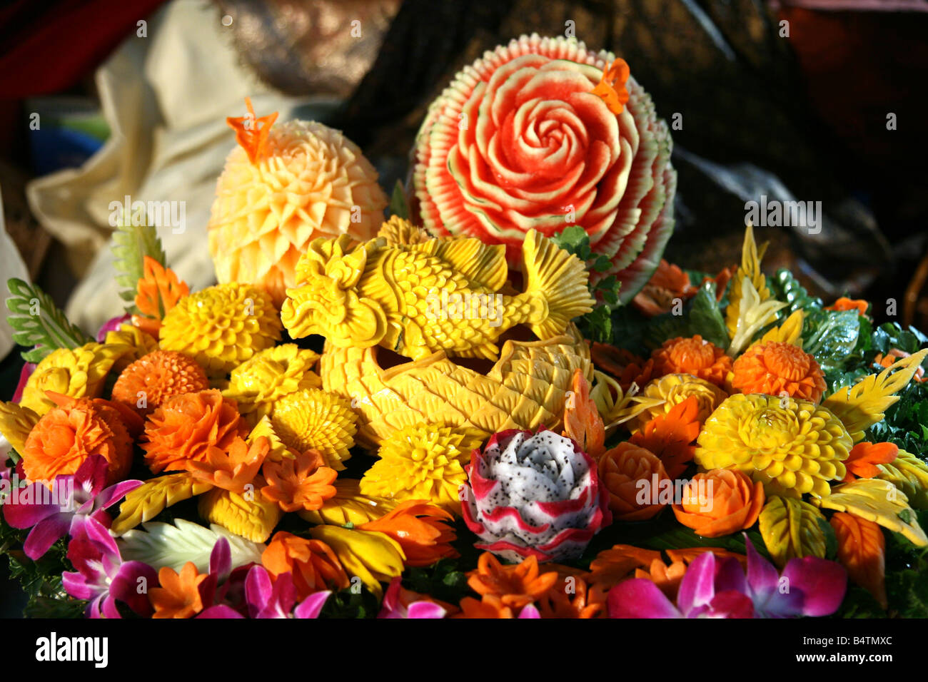 Variety of carved fruit on display Stock Photo - Alamy