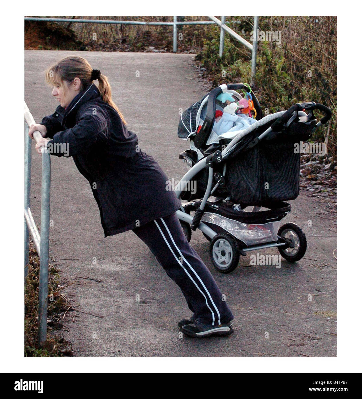 Workout queen Elaine Thomson front red jacket with her workout class ...