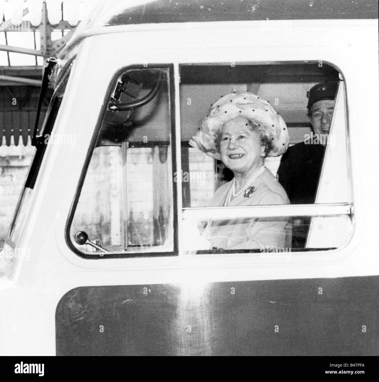 Queen Mother at window of train driving train Stock Photo - Alamy