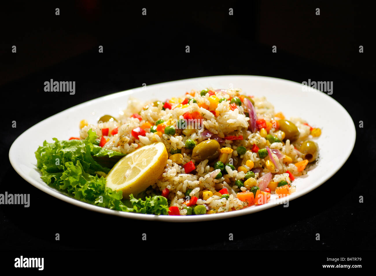 mixed vegetable rice salad with lemon Stock Photo - Alamy