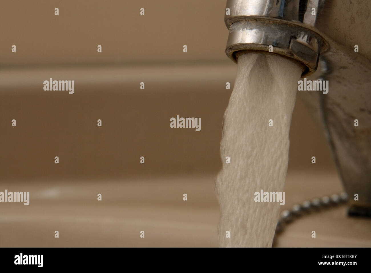 Water flowing from tap Stock Photo - Alamy