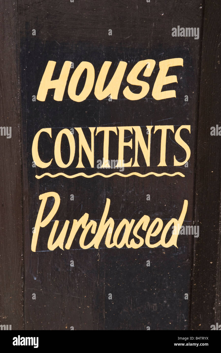 House contents purchased sign outside Pawnbrokers Stock Photo - Alamy