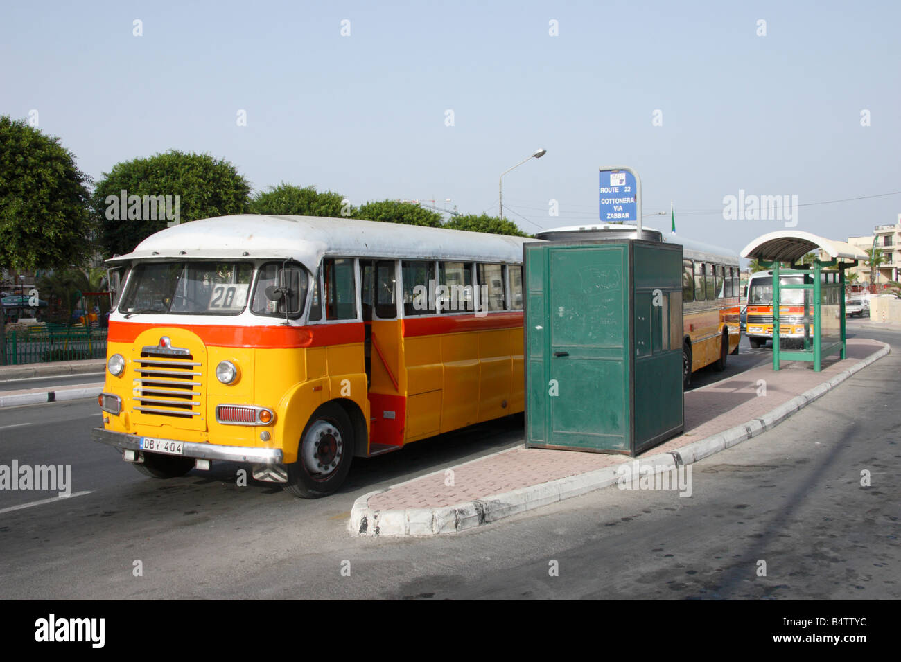 An old bright yellow Maltese bus waits at Marsaskala bus station in ...