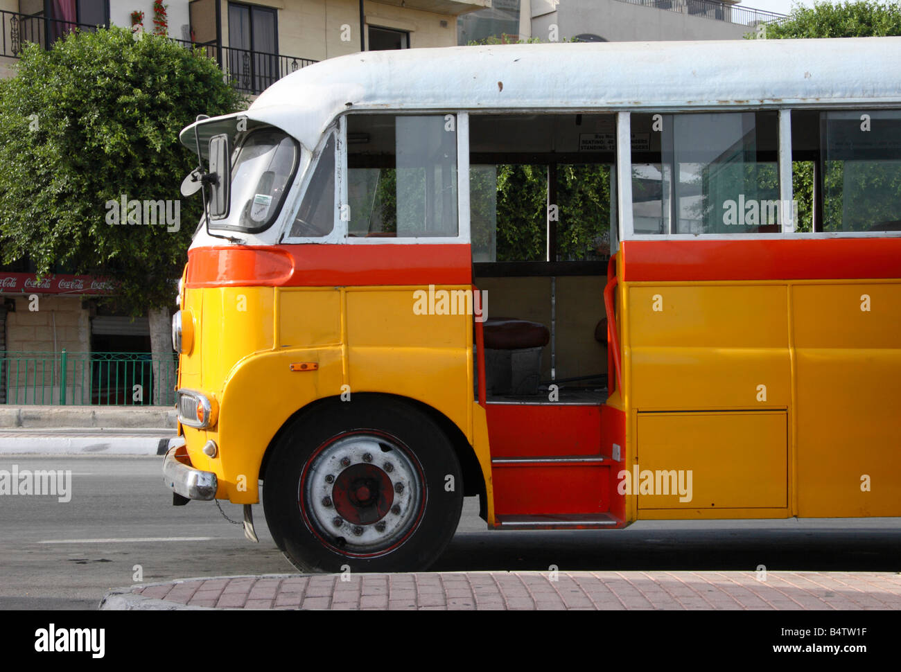 A bright yellow Maltese bus Stock Photo - Alamy