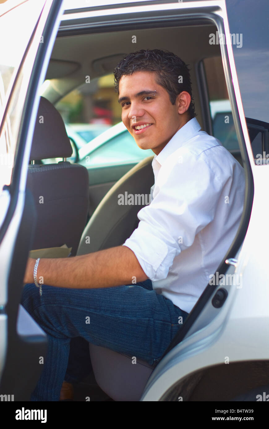Teen getting into a Car to travel Stock Photo - Alamy