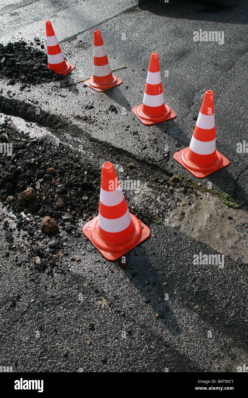 traffic cones by urban road works in city town Stock Photo - Alamy