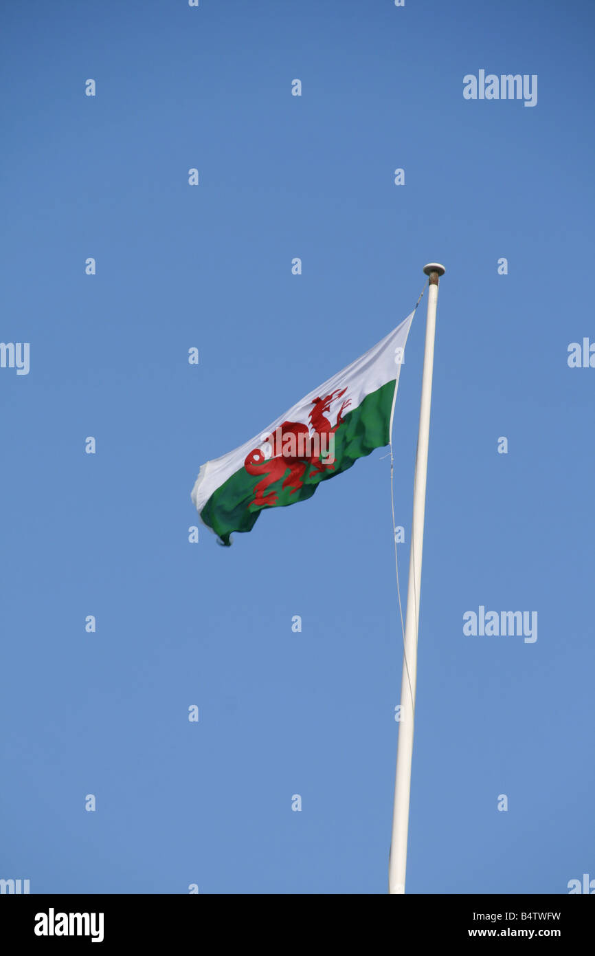welsh banner on flagpole in blue sky in sun Stock Photo - Alamy
