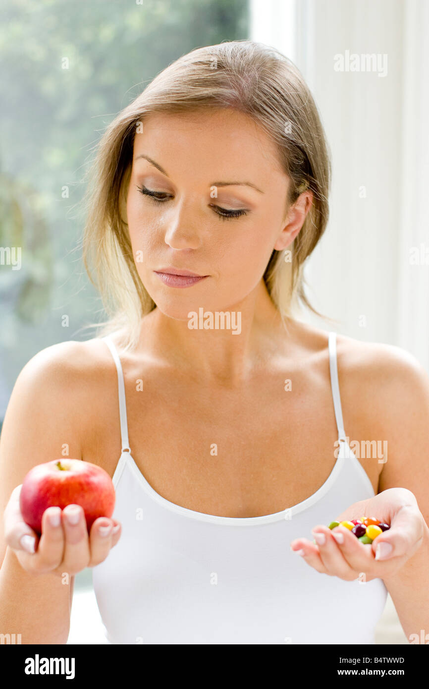 Girl making choice between healthy/unhealthy food Stock Photo - Alamy Girl making choice between healthy/unhealthy food Stock Photo - Alamy