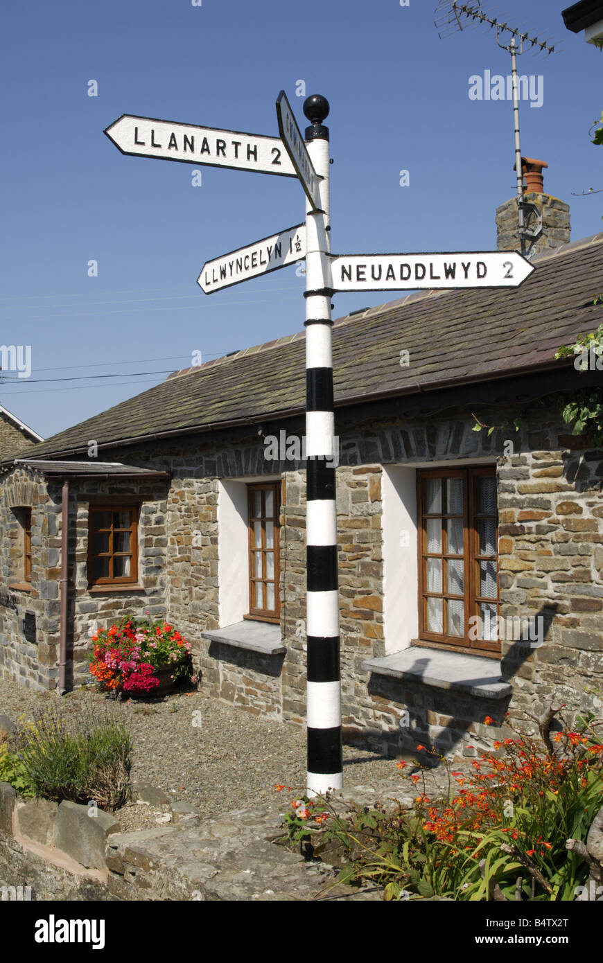 traditional sign post showing Welsh place names in pretty mid Wales ...