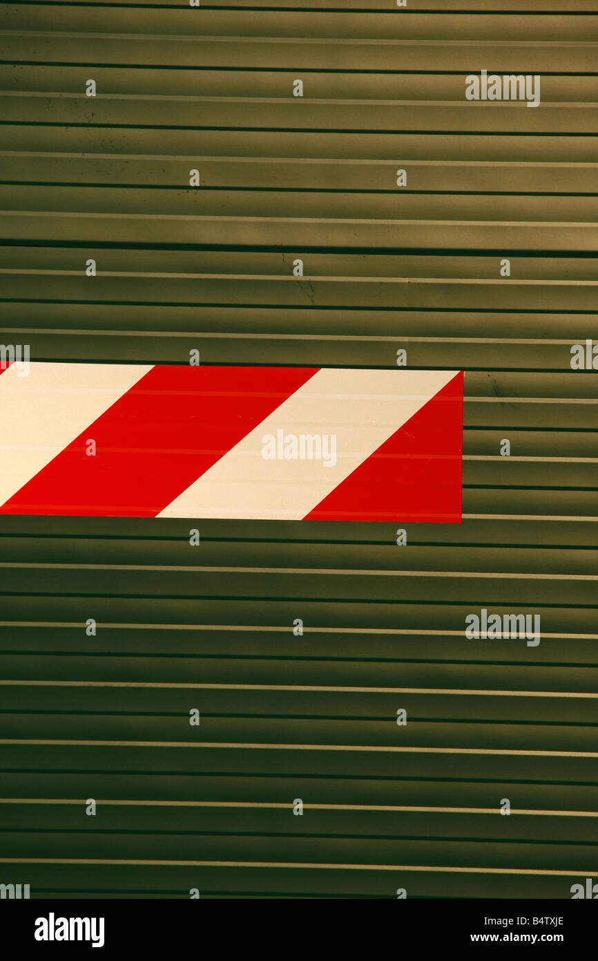 red and white warning marks on side of building site temporary plastic ...
