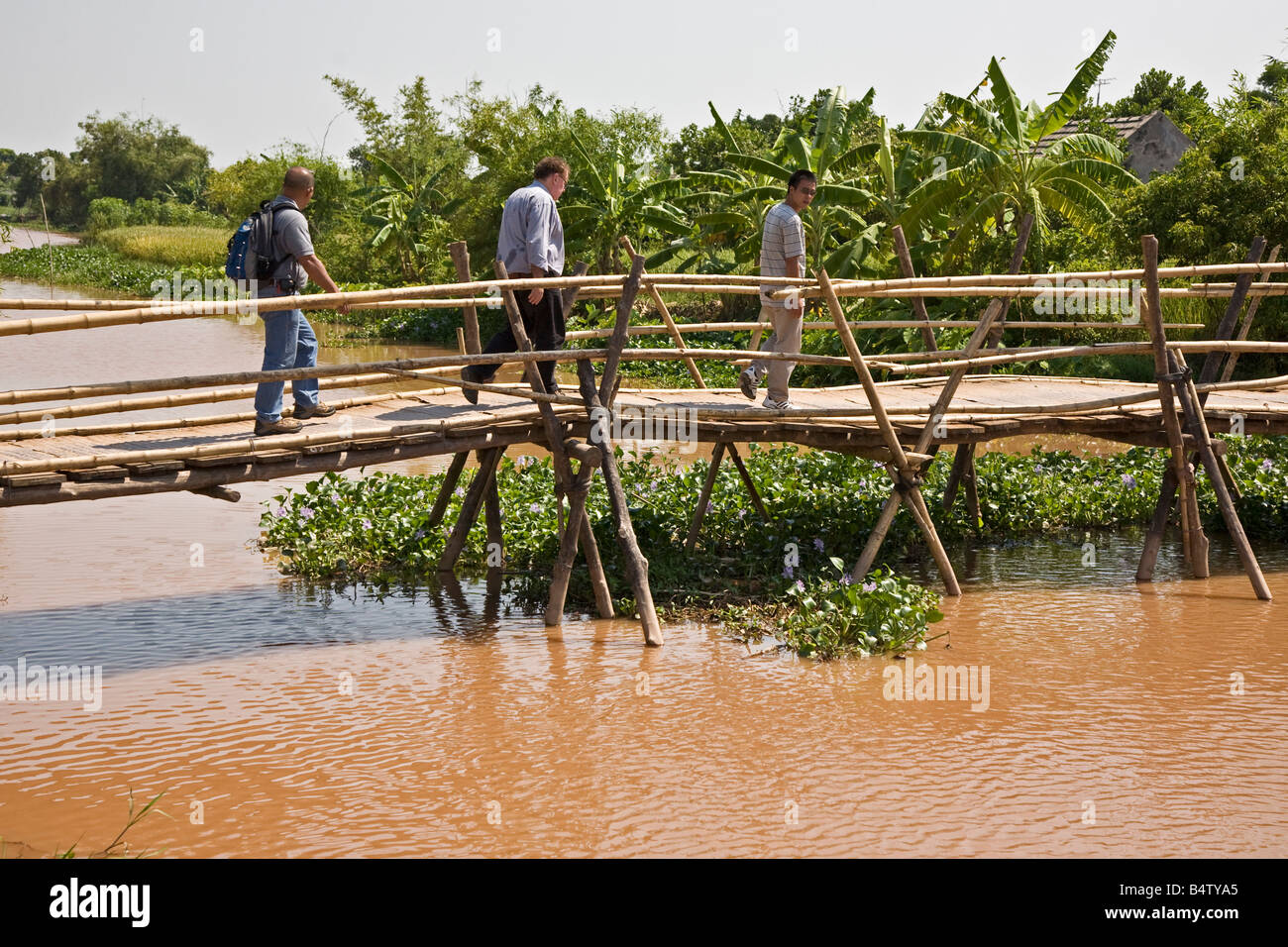 Tourists wooden bridge Red River delta north Vietnam Stock Photo - Alamy