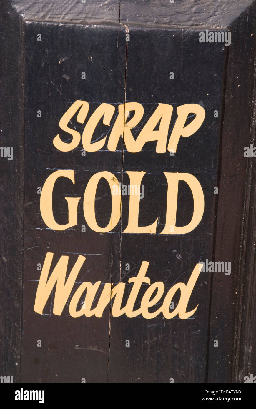 Scrap gold wanted sign outside Pawnbrokers Stock Photo - Alamy