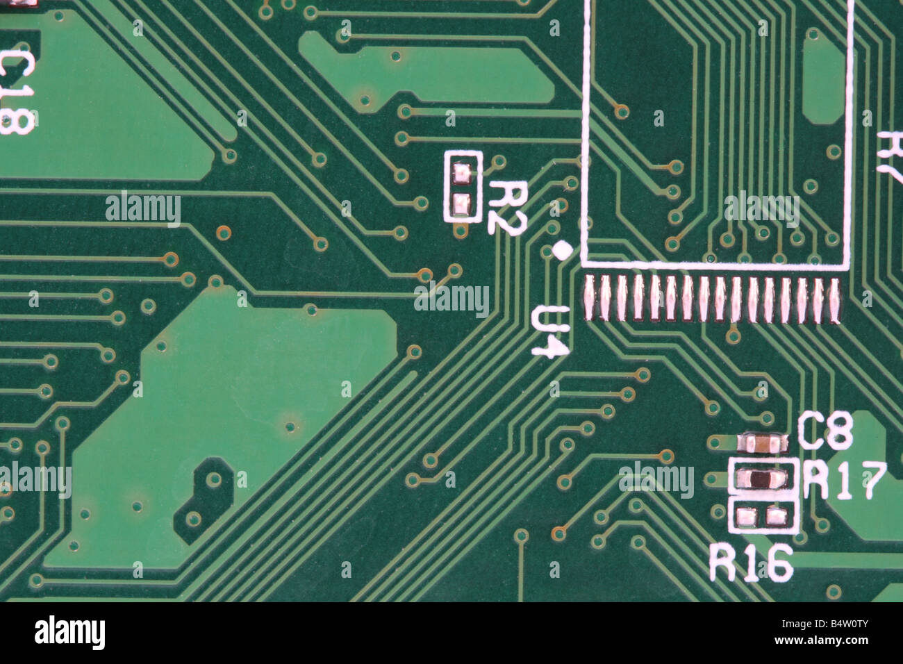 closeup detail from green circuit board electronics and technology ...