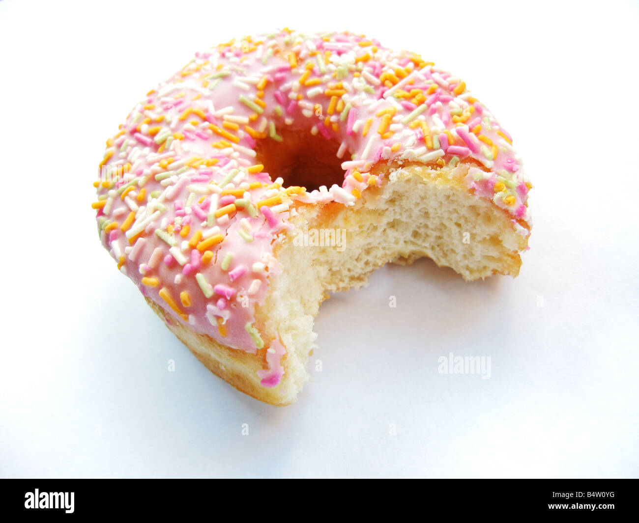 Iced doughnut with bite taken from it Stock Photo - Alamy