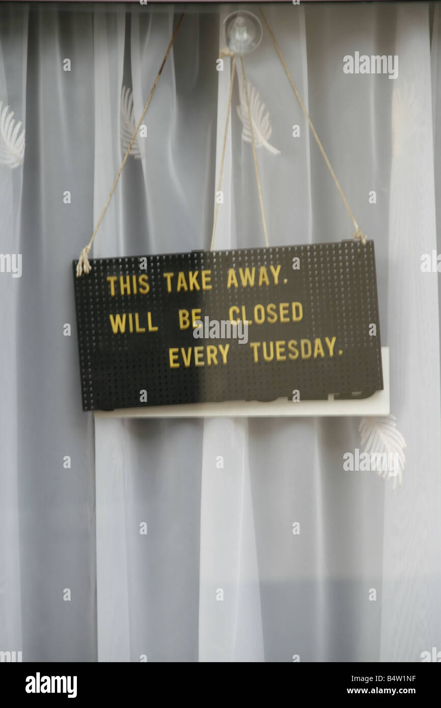 closed on tuesday sign in fast food take away shop Stock Photo - Alamy