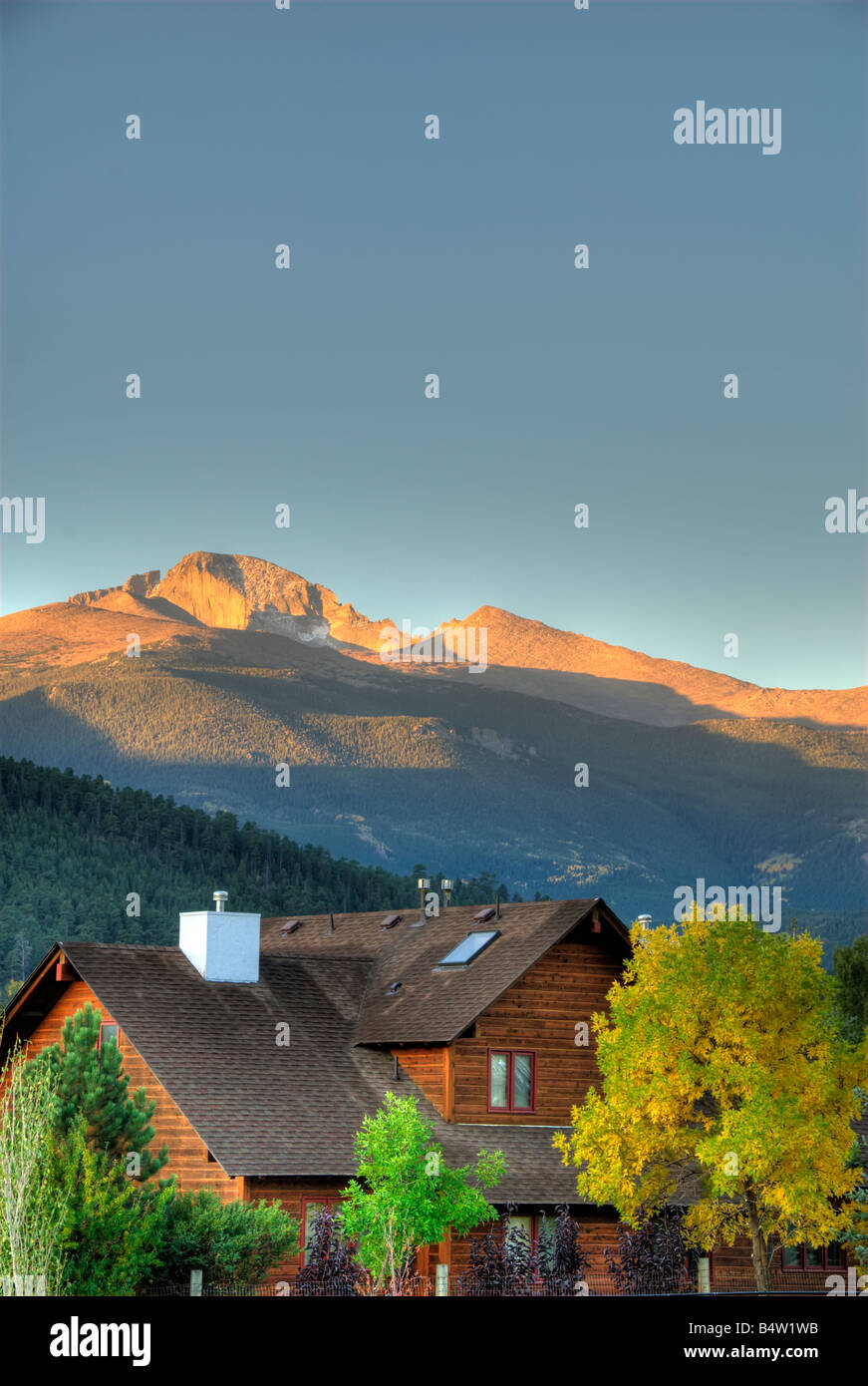 rustic cabin in rocky mountains of colorado with longs peak in ...