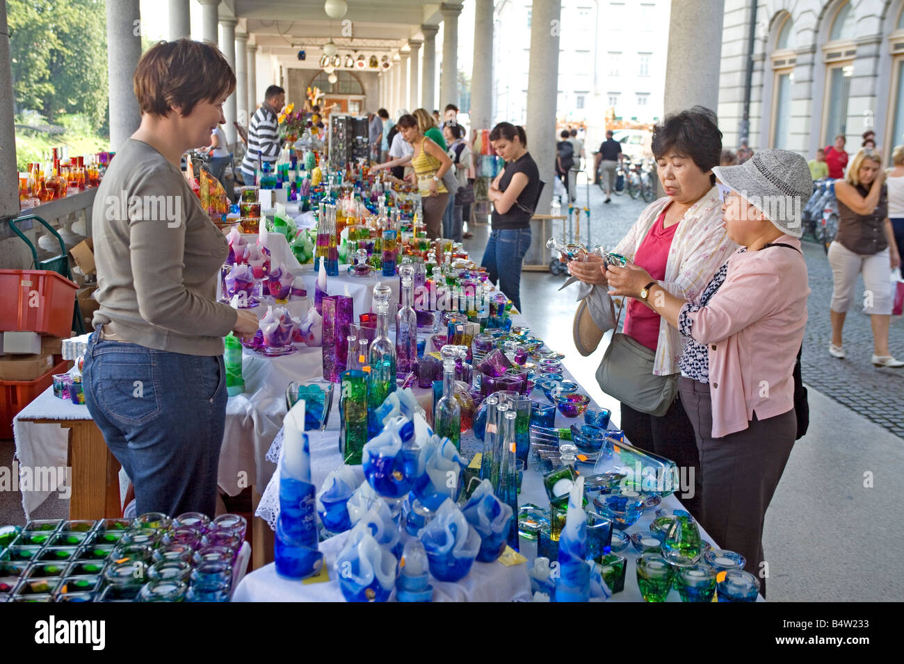 Tourist shopping for souvenirs at marketplace in Ljubljana the capital ...