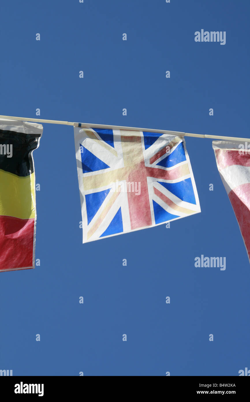 old faded union jack flag flying in wind in sun Stock Photo - Alamy
