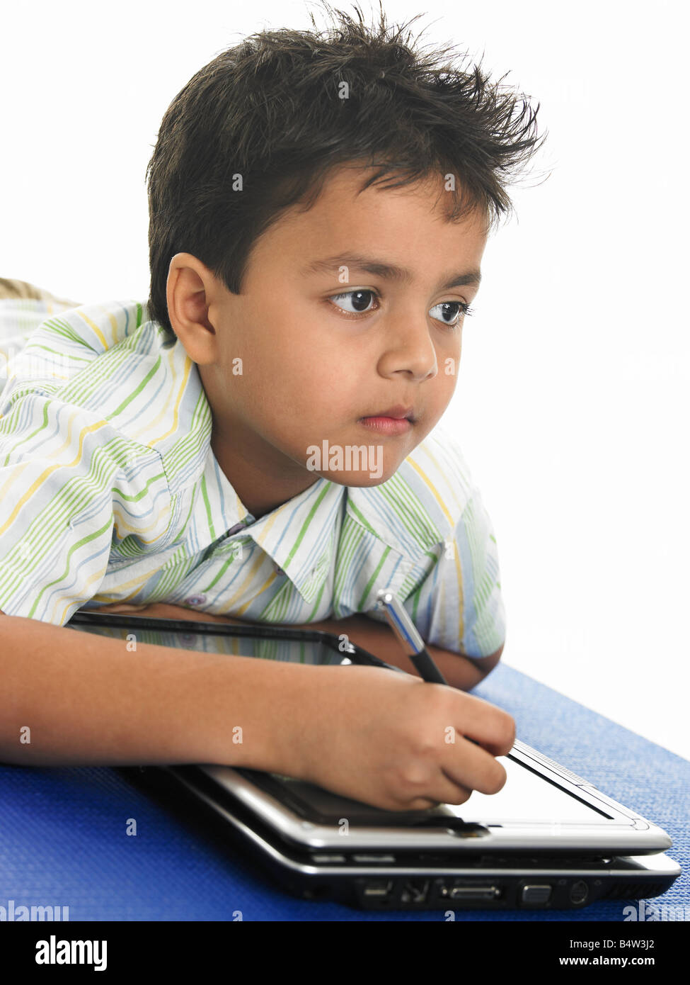 Asian boy with his laptop Stock Photo - Alamy