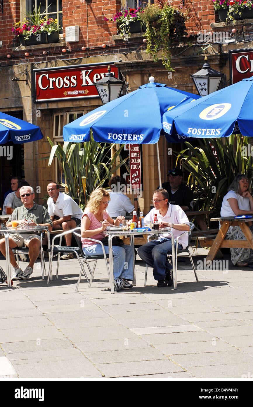 People sitting outside a pub in England having a drink and enjoyng the ...