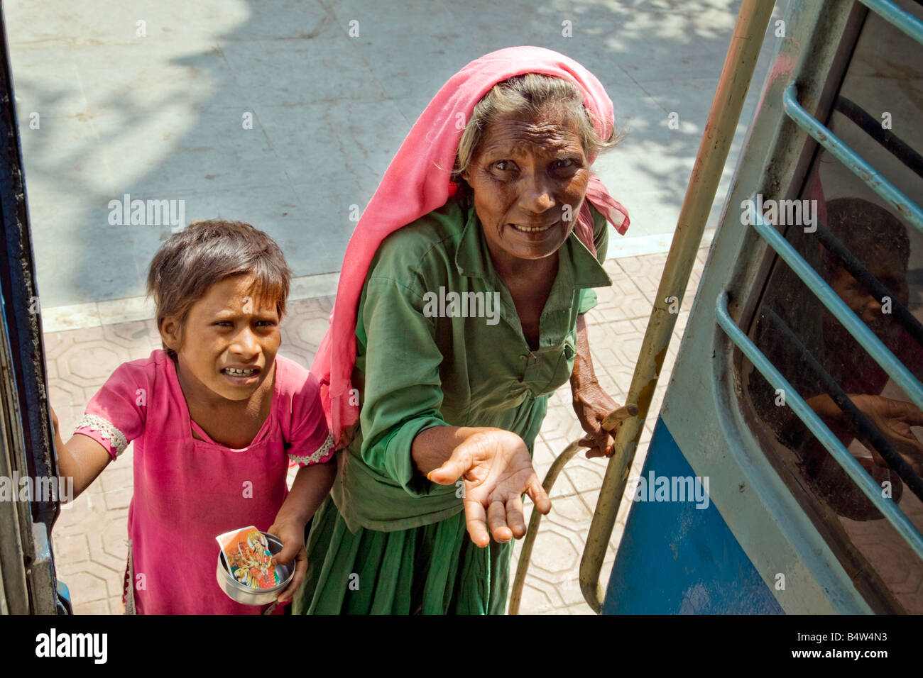 Poor elderly indian woman begging hi-res stock photography and images ...