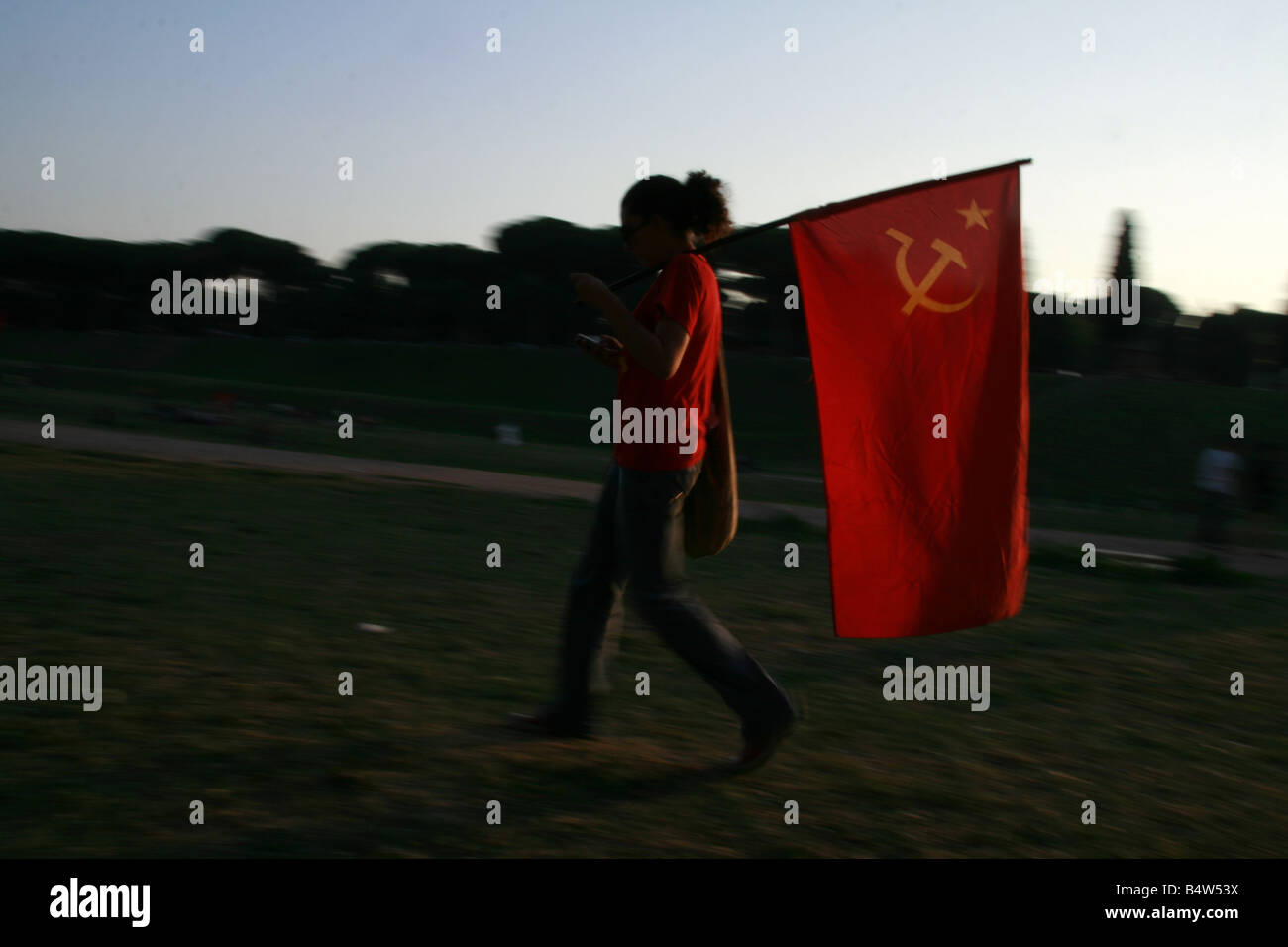 girl with communist soviet union flag at political rally in rome italy ...