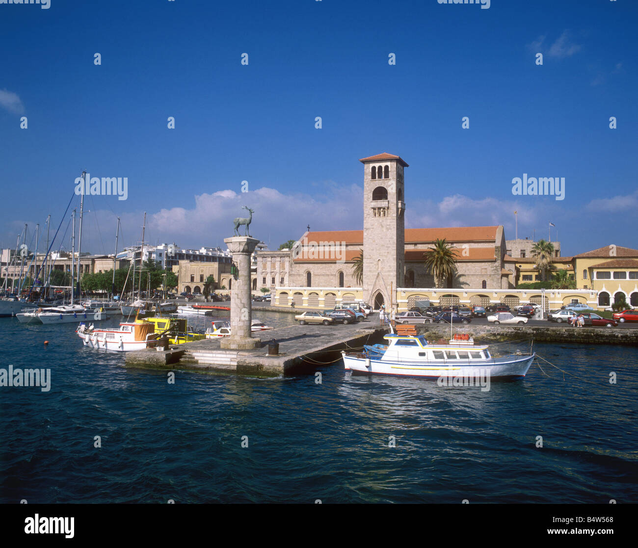 Rhodes - Entrance to Mandraki Harbour in Rhodes Town Stock Photo - Alamy