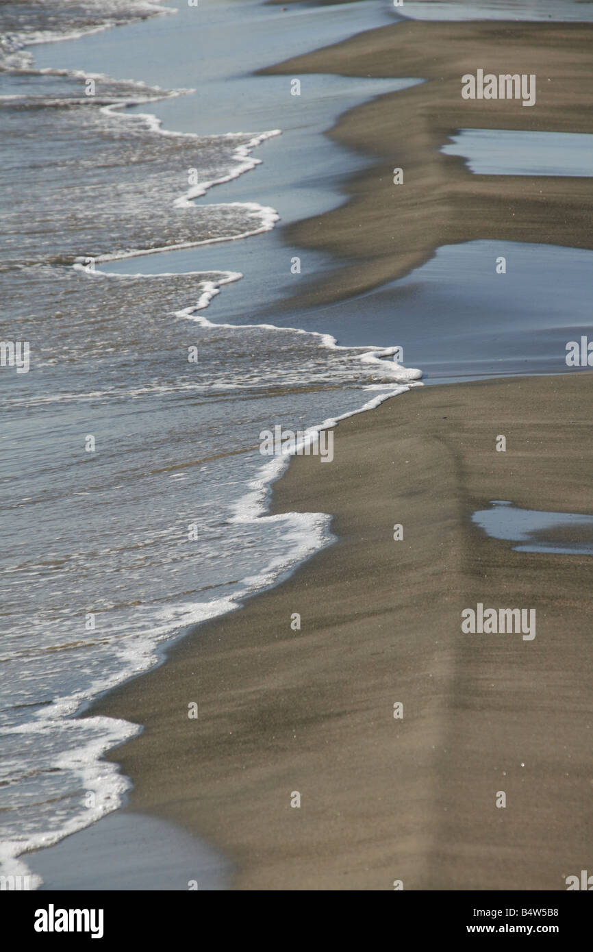 sea wave on sand on beach coast shore Stock Photo - Alamy