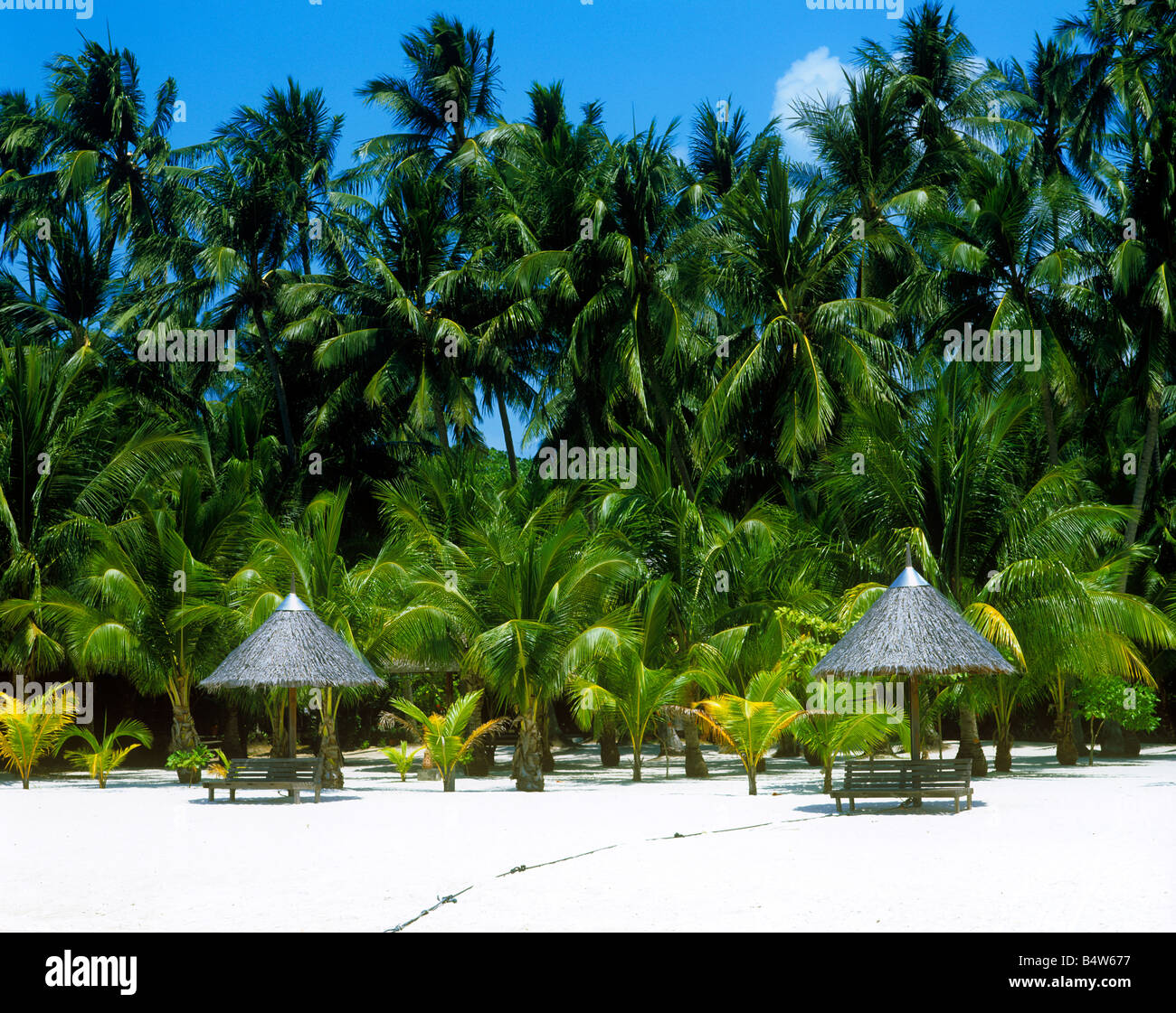 Two huts on the white sand beach, Mabul Island, Sabah, Borneo, Malaysia ...