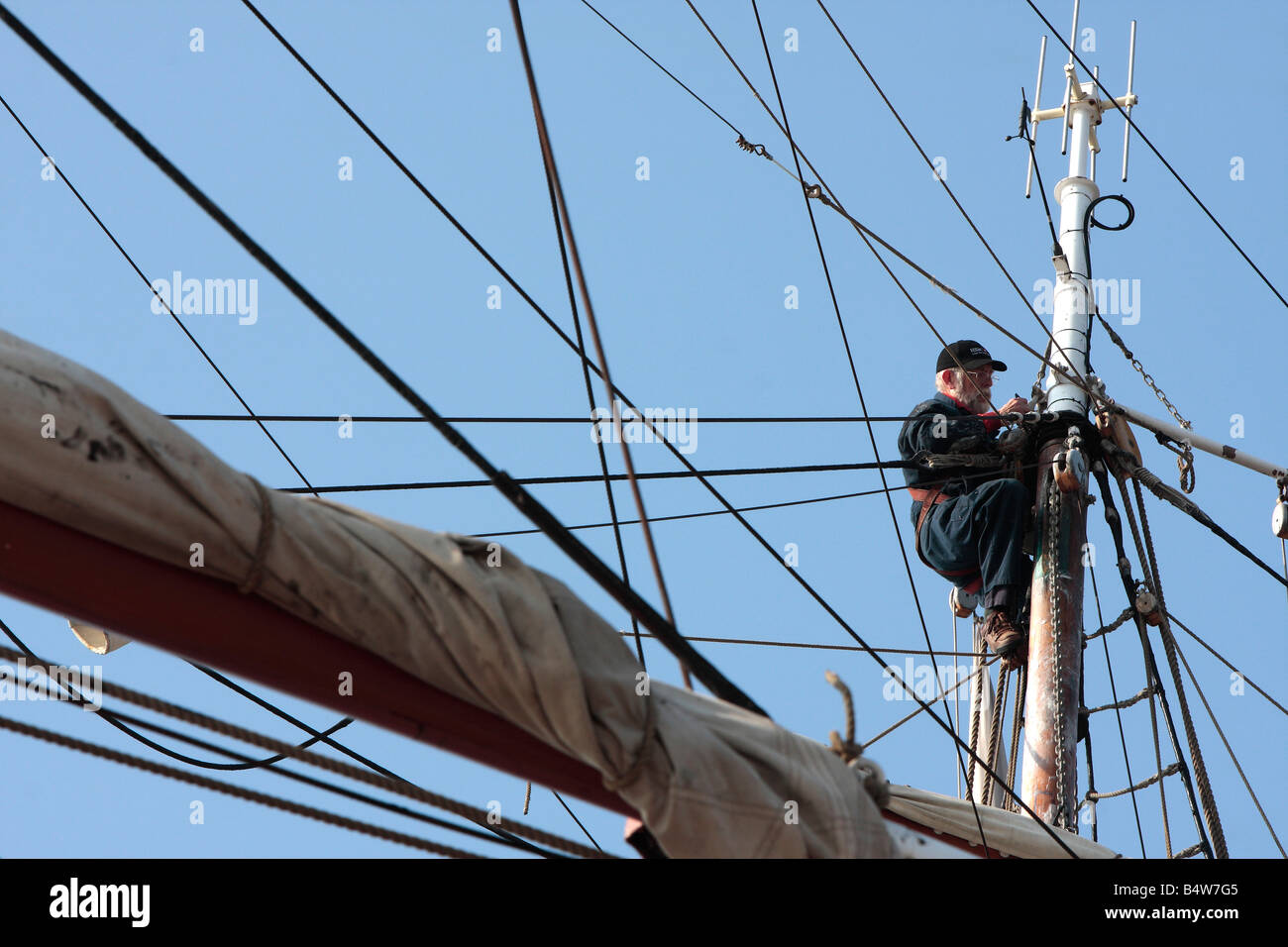 Sailor in the rigging Stock Photo - Alamy