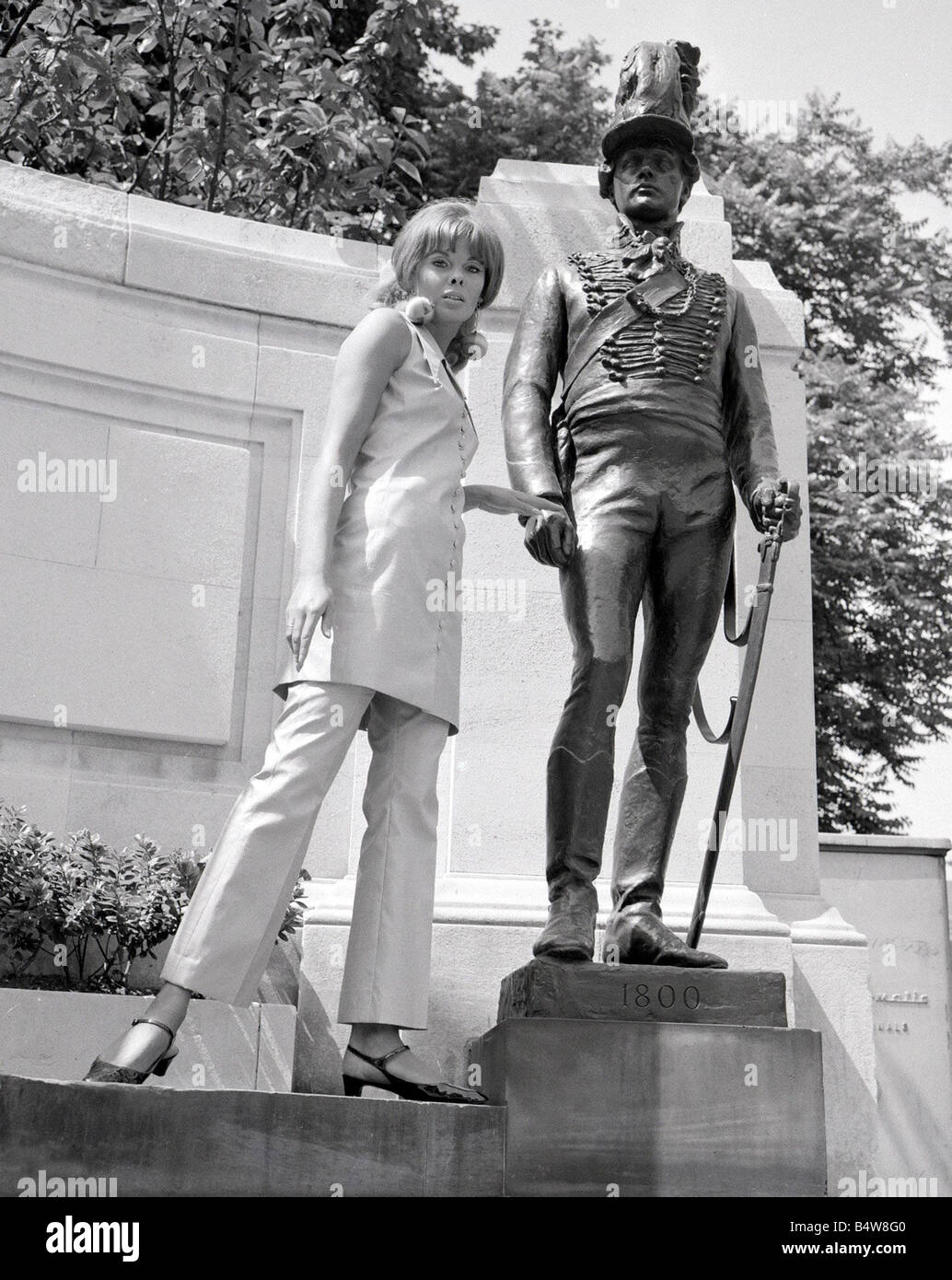 Model Bo Bo White modelling a trouser suit which becomes a mini dress ...