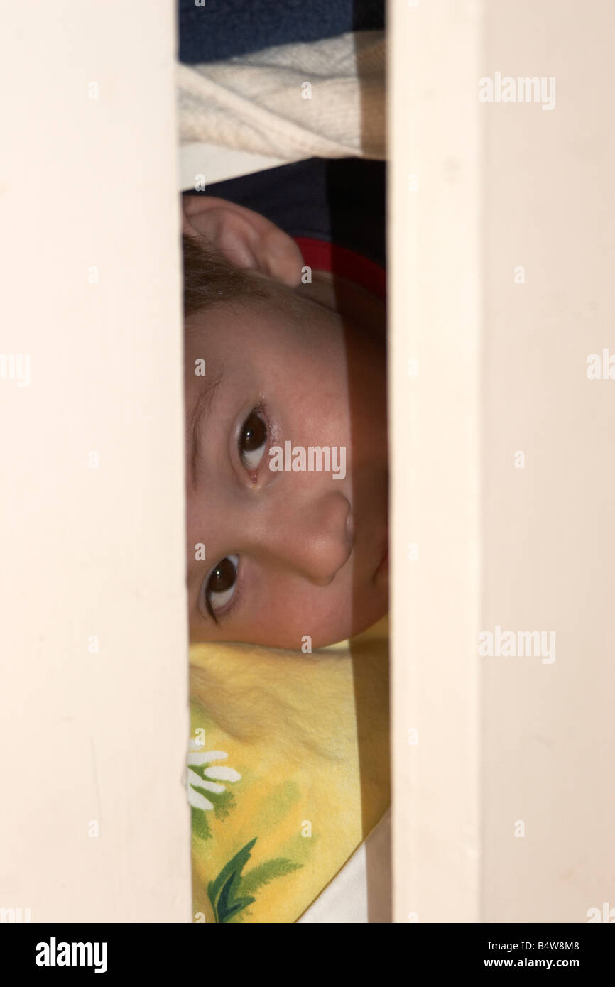 Child boy hiding in cupboard hi-res stock photography and images - Alamy